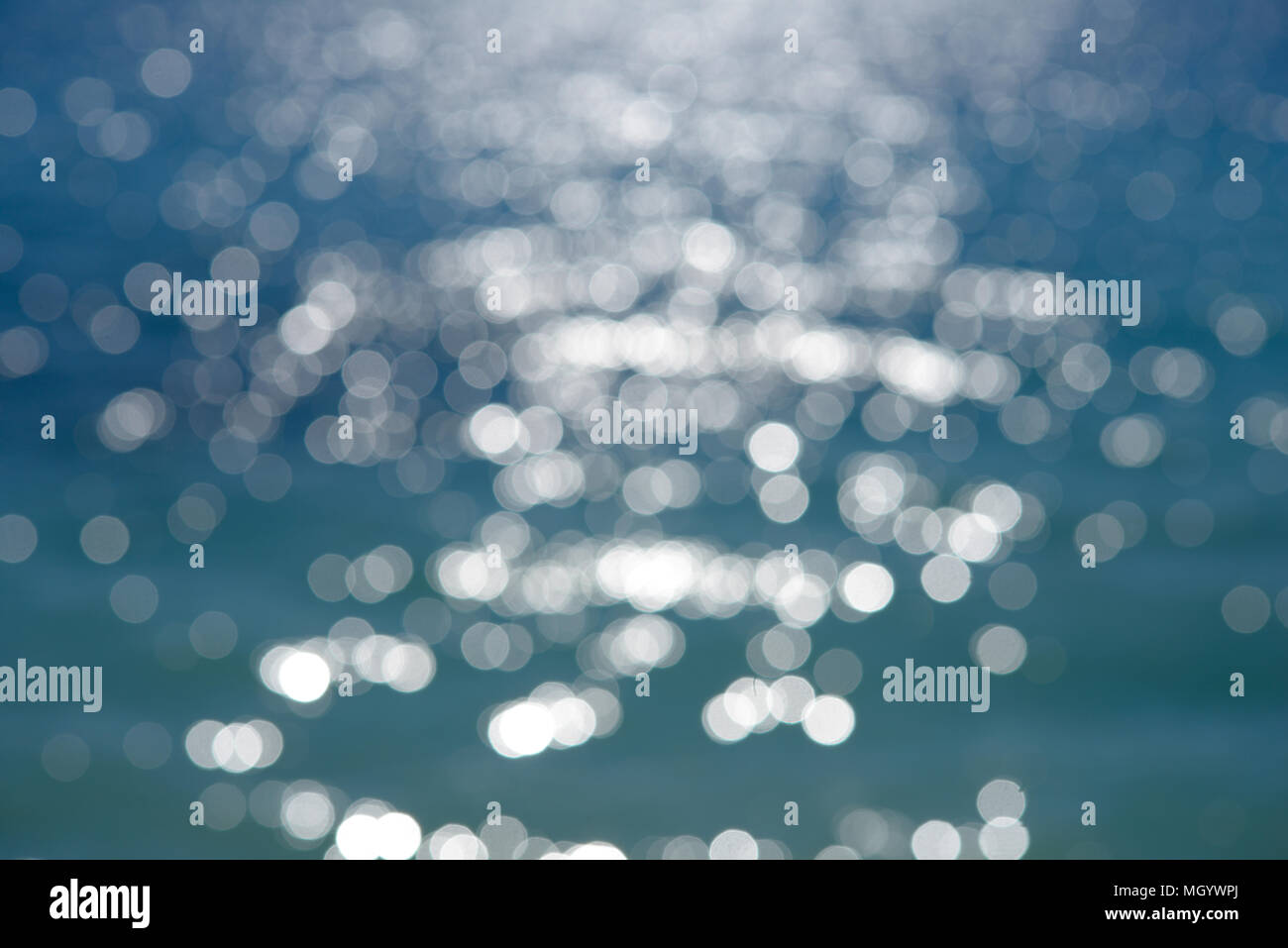 Ocean background with defocused sunlight Stock Photo - Alamy