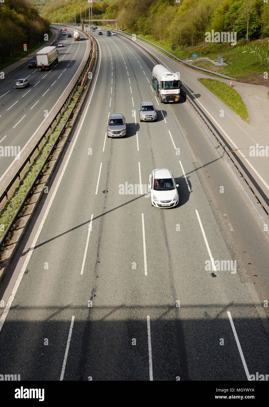 M60 four lane motorway section, elevated view with light traffic at ...