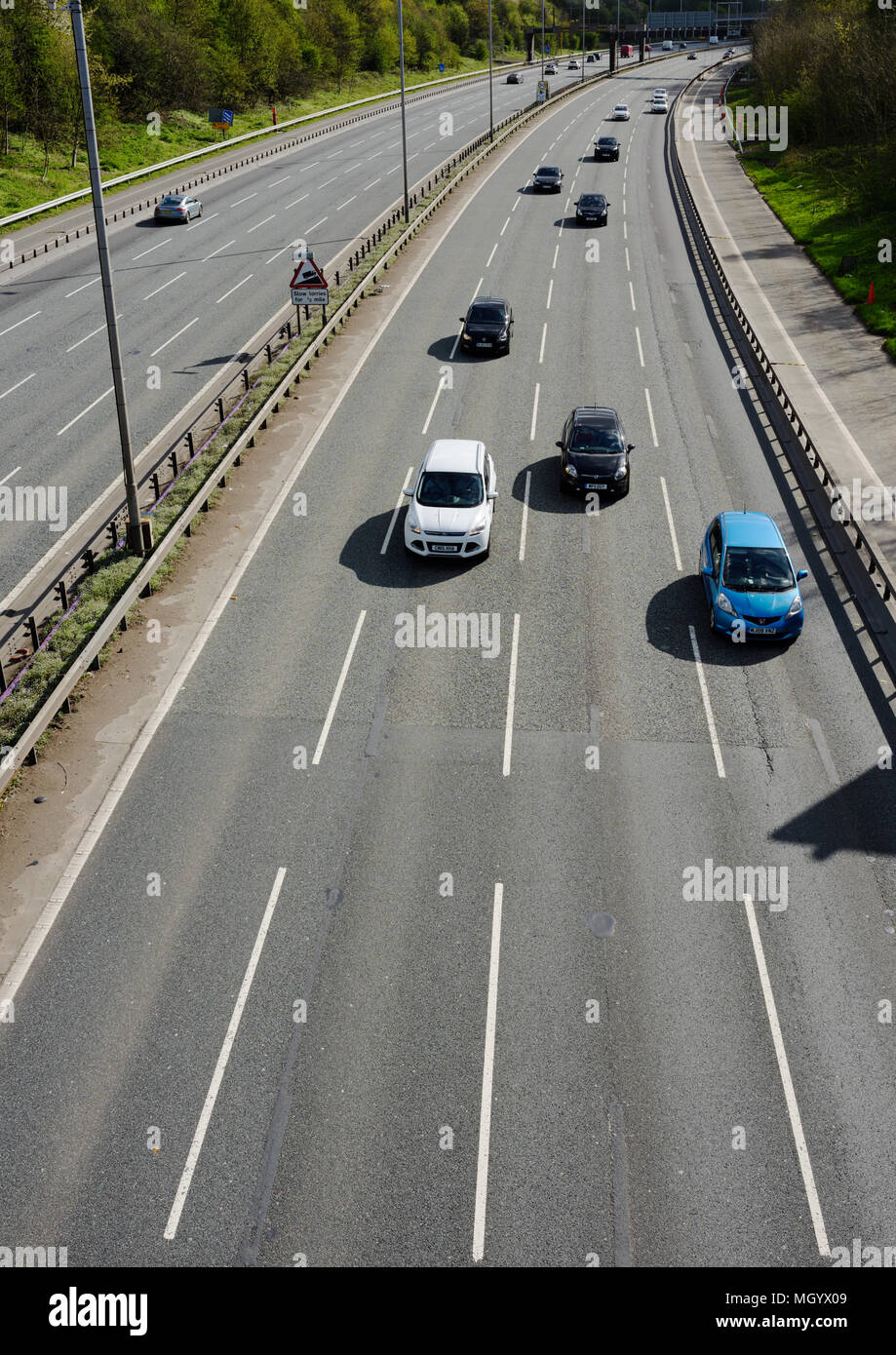 M60 four lane motorway section, elevated view with light traffic at ...