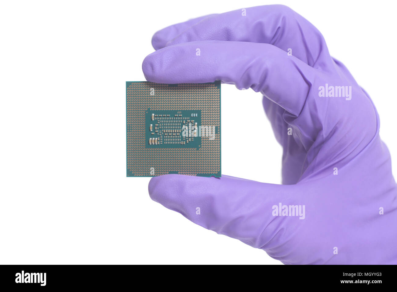 Hand in purple glove holding a CPU computer processor microchip ...