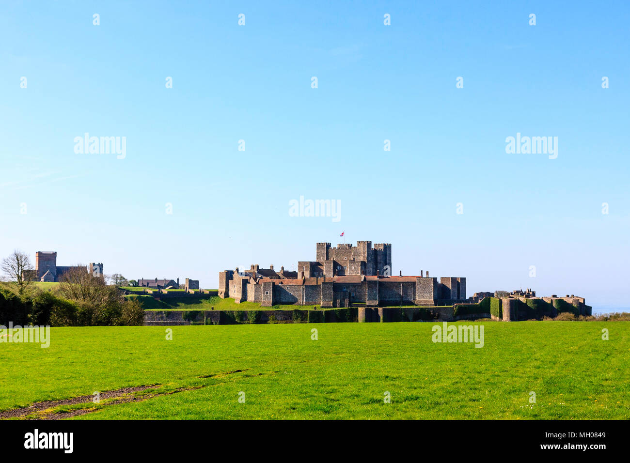 Dover castle, England. Distant view across field of the outer walls ...
