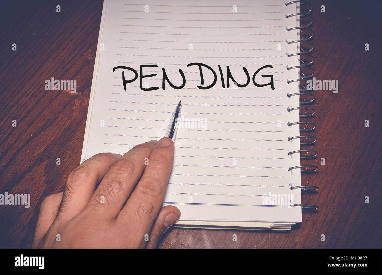 Pending word written on white paper Stock Photo - Alamy