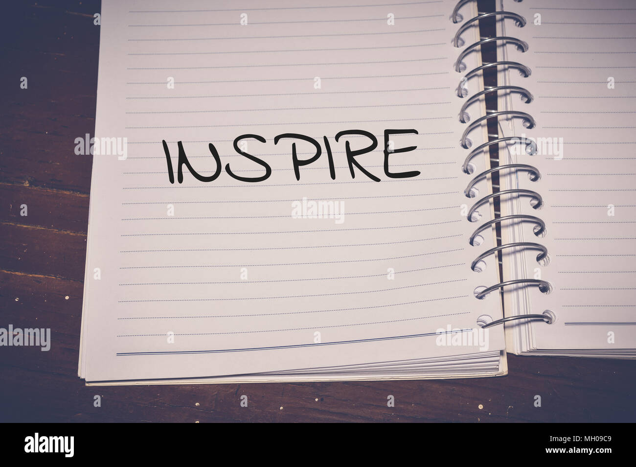 Inspire word written on white paper Stock Photo - Alamy