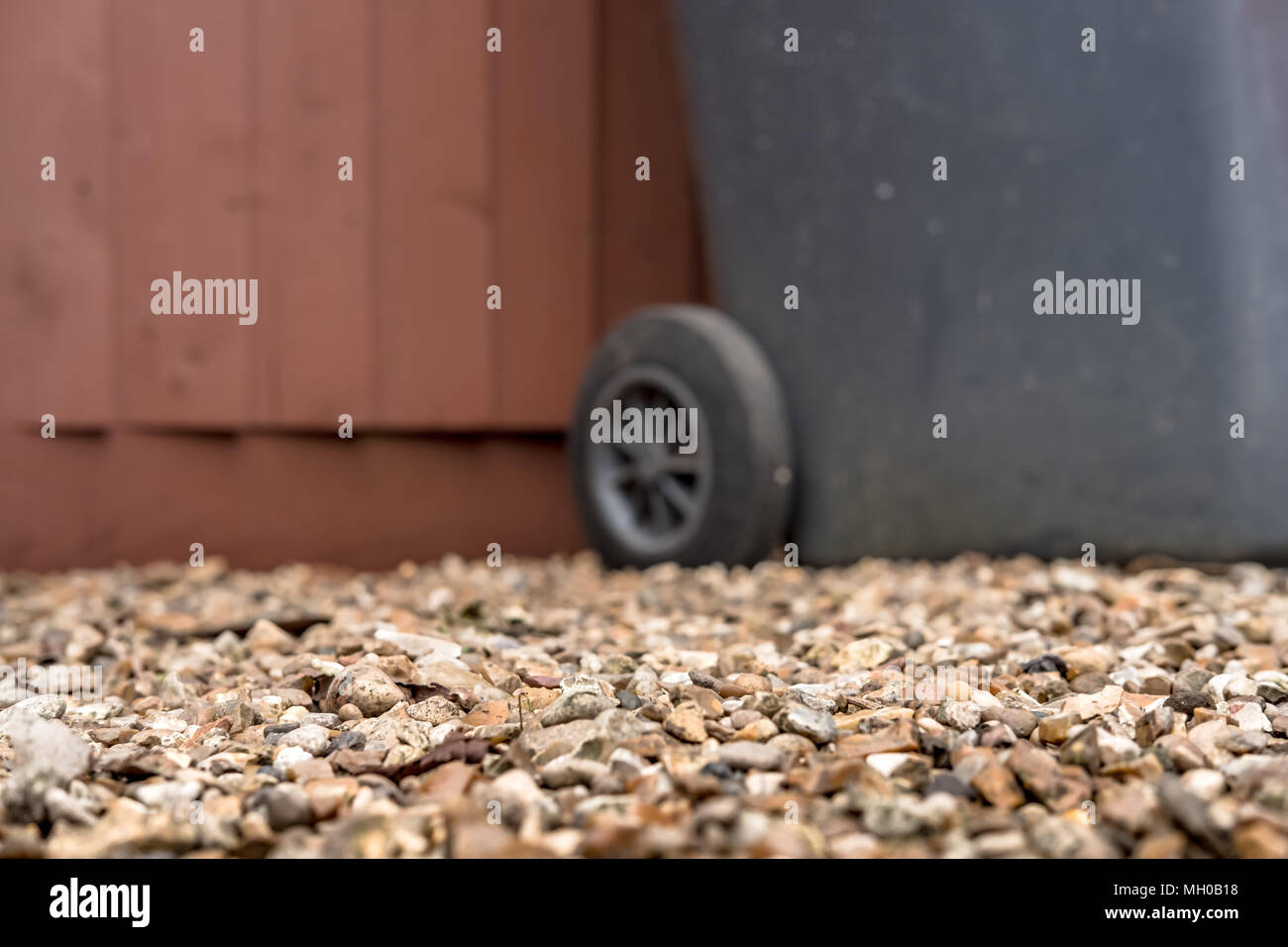 Shallow focus image of a general household waste wheelie bin showing ...