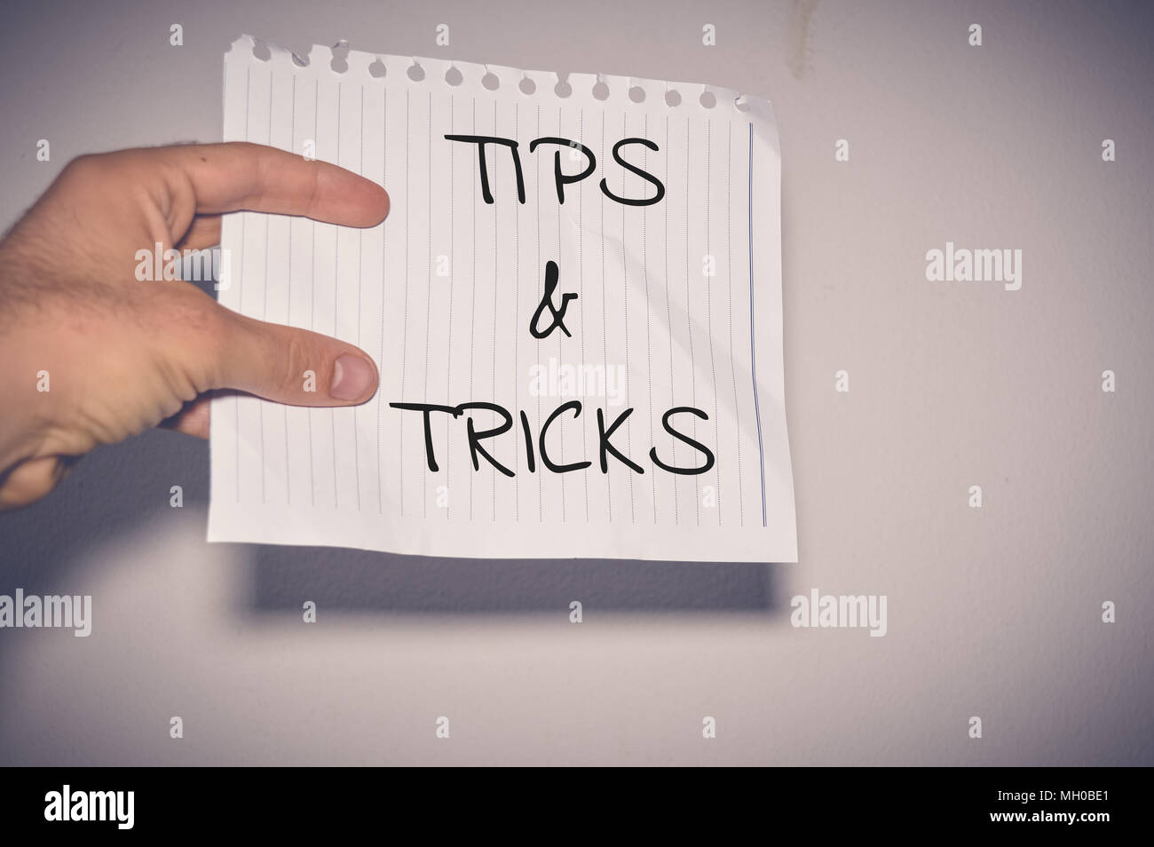 Tips & tricks word written on white paper Stock Photo - Alamy