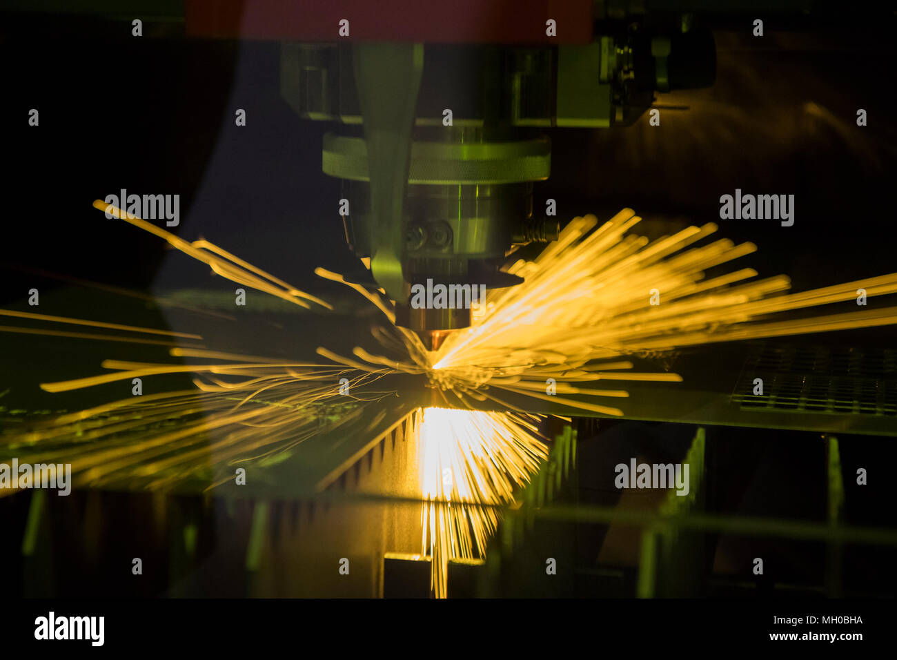laser cutting metal plate ; sparks light Stock Photo - Alamy