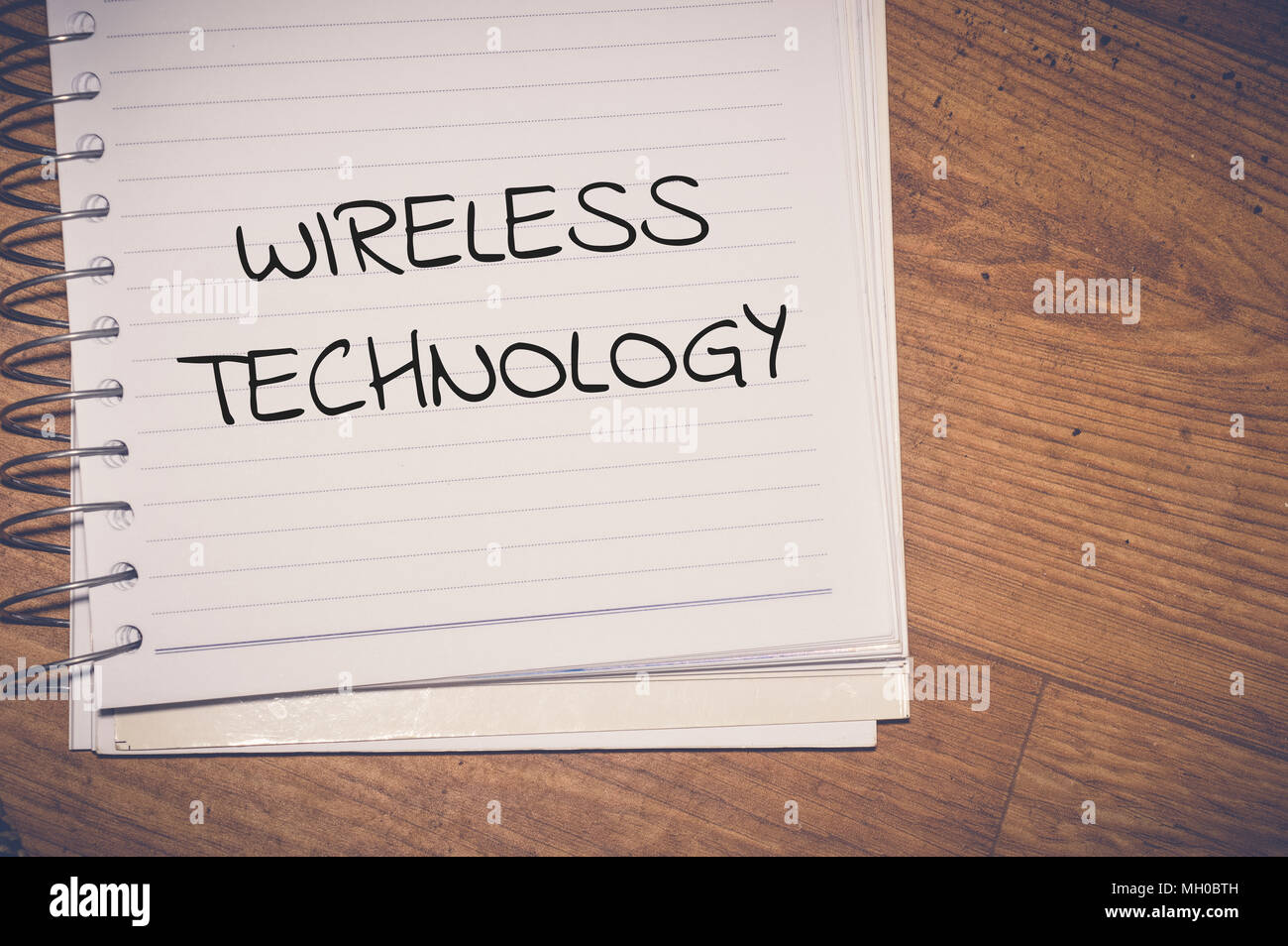 Wireless technology word written on white paper Stock Photo - Alamy