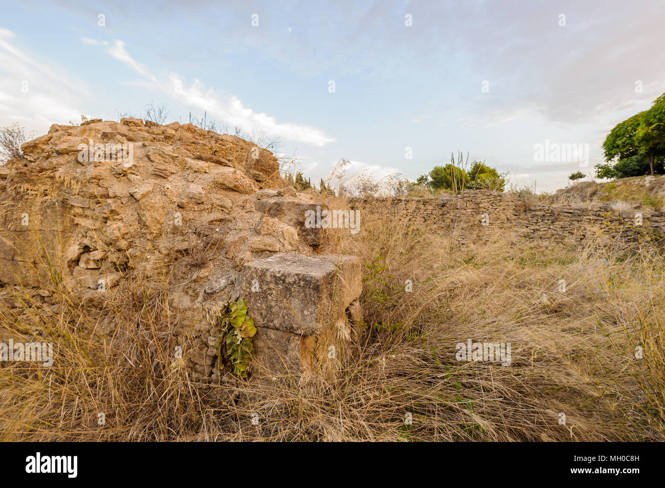 Sunset over the excavated ruins of the ancient city of the bronze age ...