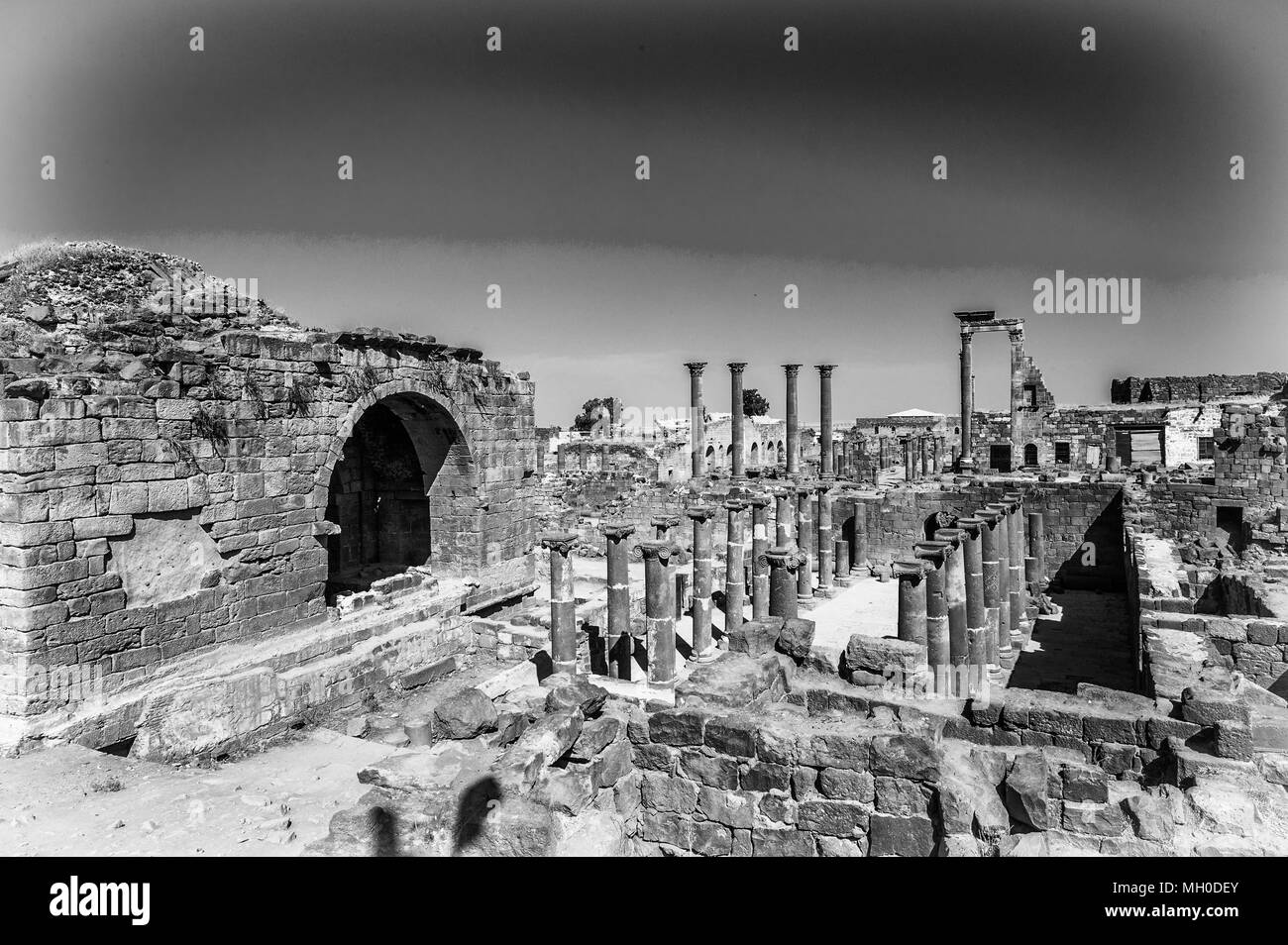 Roman ruins north of the citadel (in black and white). City of Bosra ...
