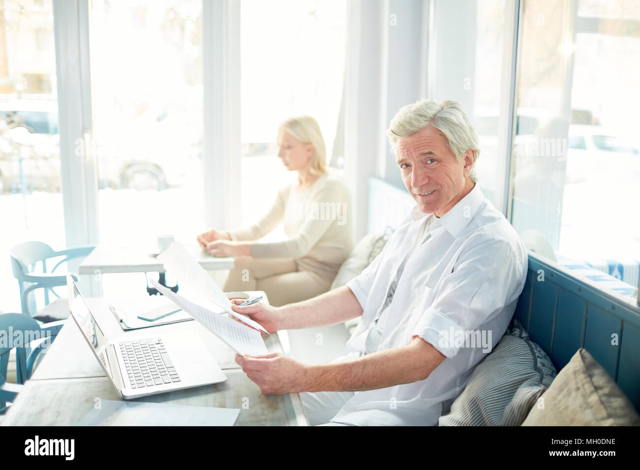 Man with papers Stock Photo - Alamy