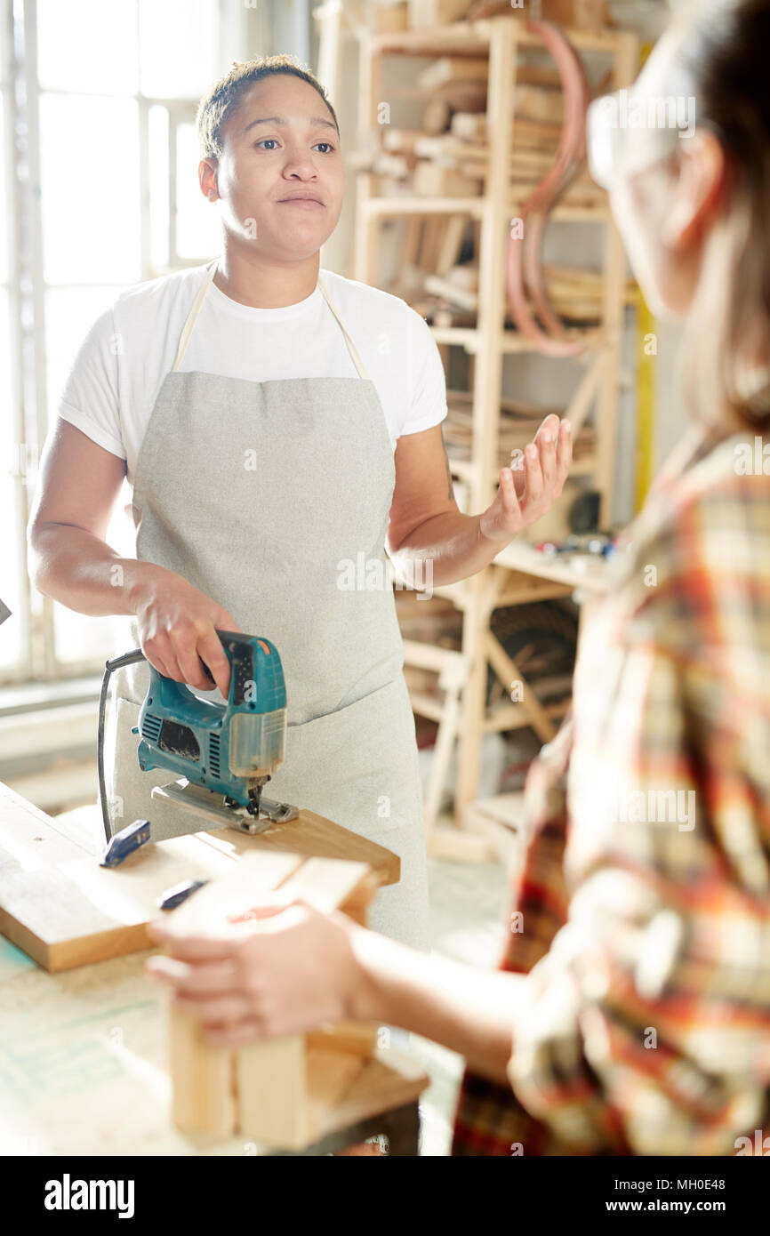 Talking at work Stock Photo - Alamy
