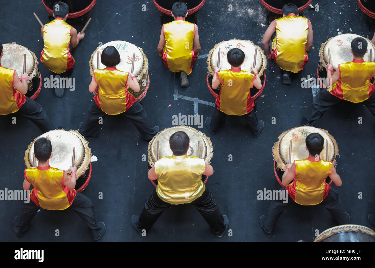 Teenagers performing chinese lion dance drum rhythmic show and dance at ...