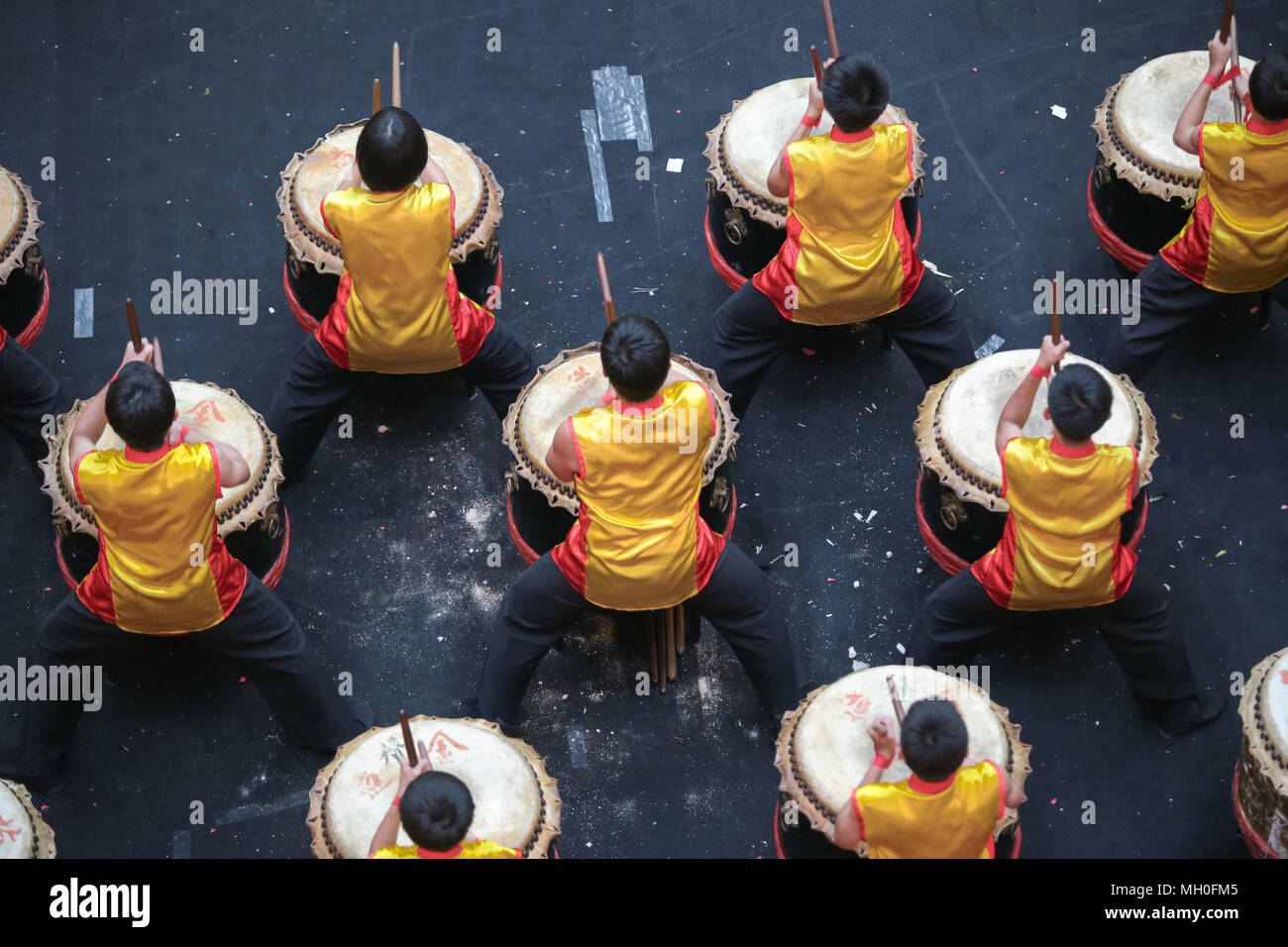 Teenagers performing chinese lion dance drum rhythmic show and dance at ...