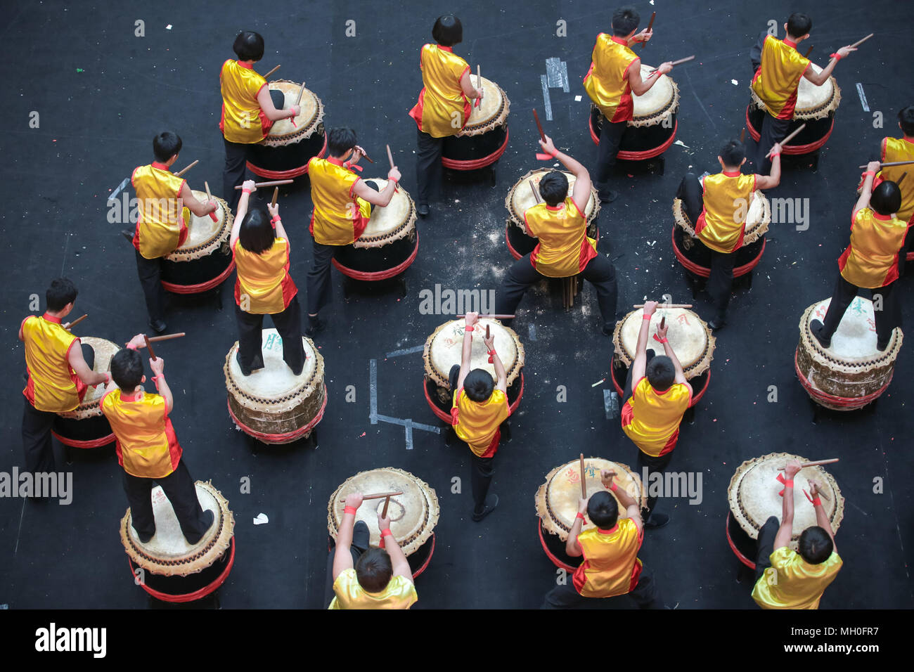Teenagers performing chinese lion dance drum rhythmic show and dance at ...