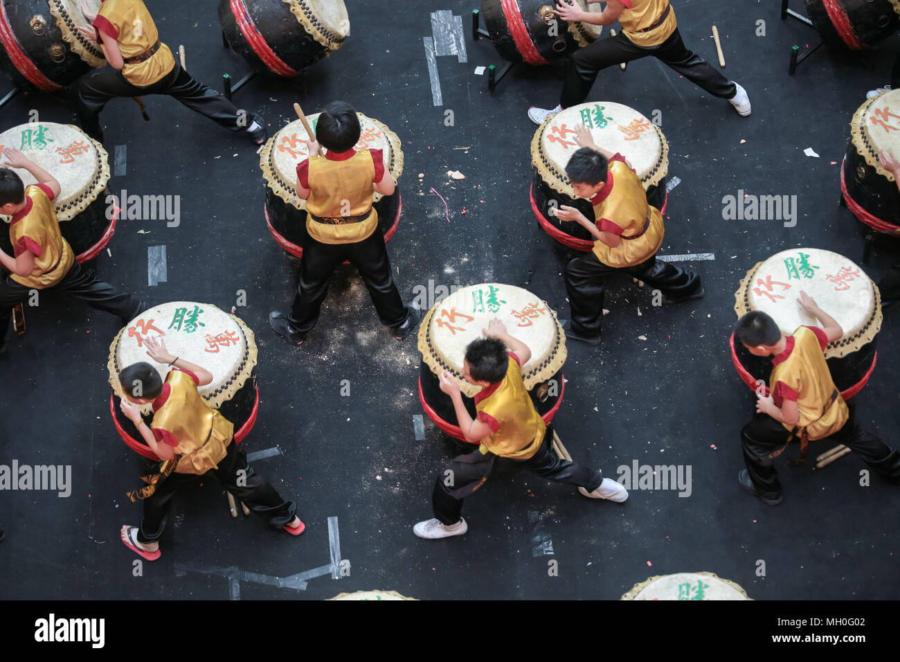 Teenagers performing chinese lion dance drum rhythmic show and dance at ...