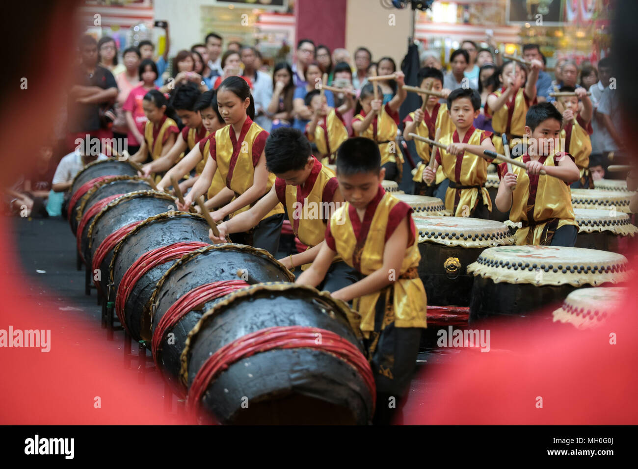 Teenagers performing chinese lion dance drum rhythmic show and dance at ...