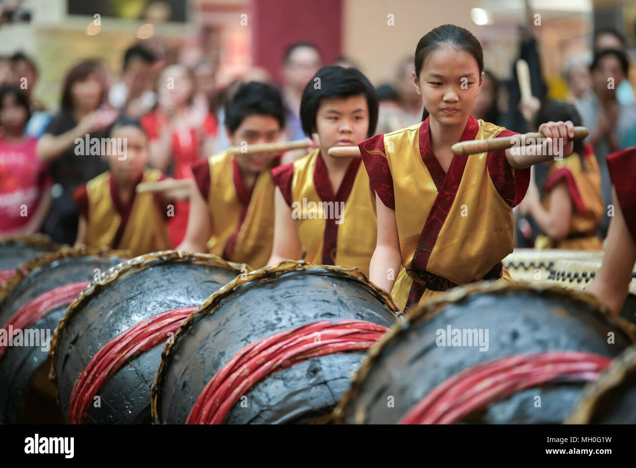 Teenagers performing chinese lion dance drum rhythmic show and dance at ...