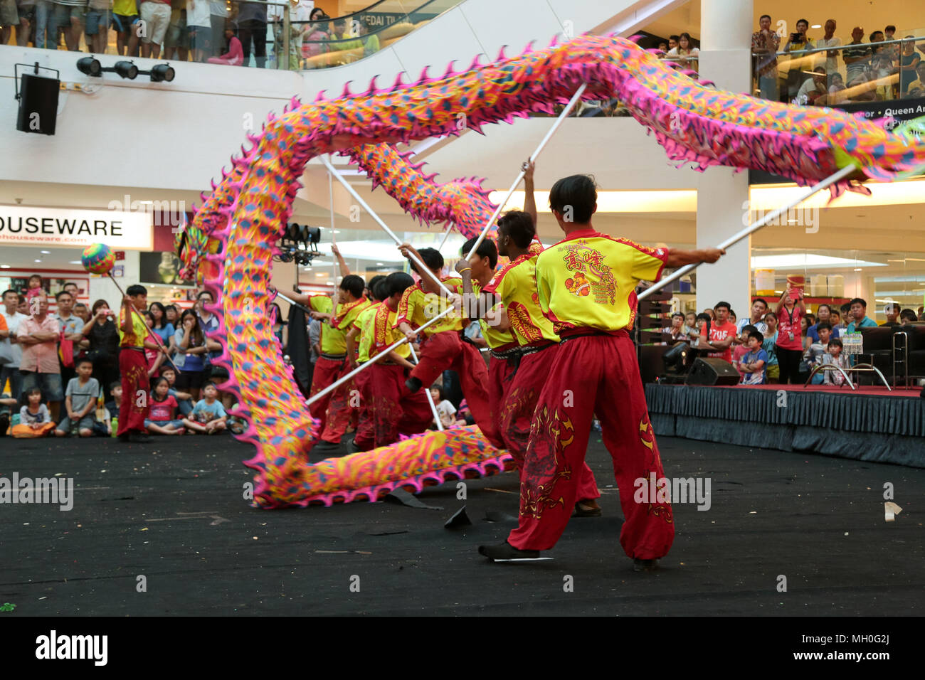 Group of teenagers orchestrating traditional dragon dance at VIVA HOME ...