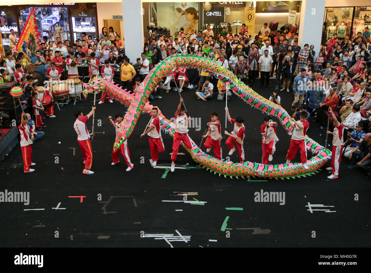 Group of teenagers orchestrating traditional dragon dance at VIVA HOME ...