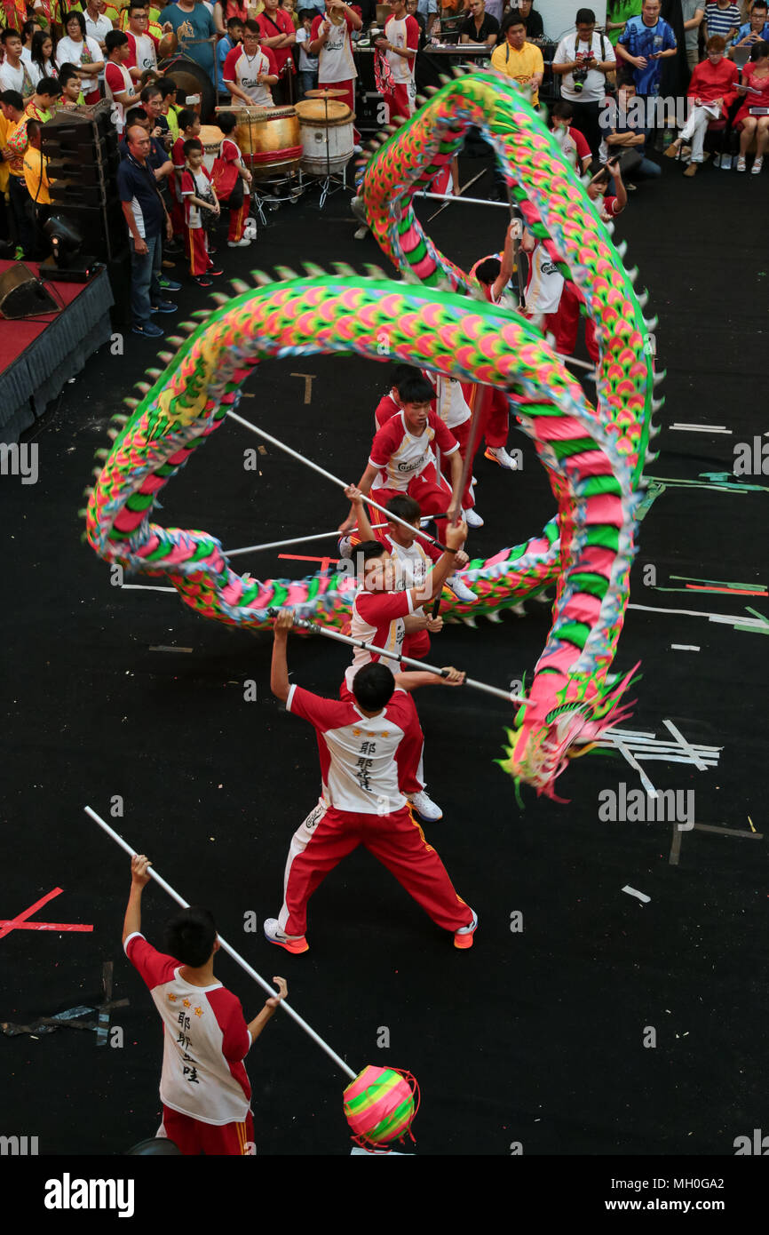Group of teenagers orchestrating traditional dragon dance at VIVA HOME ...