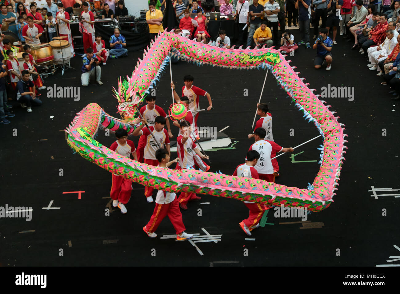 Group of teenagers orchestrating traditional dragon dance at VIVA HOME ...