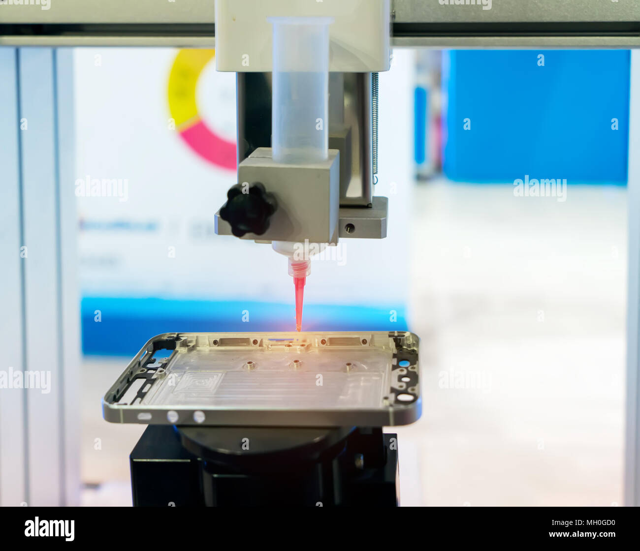 Robot holding glue syringe Injection Stock Photo - Alamy