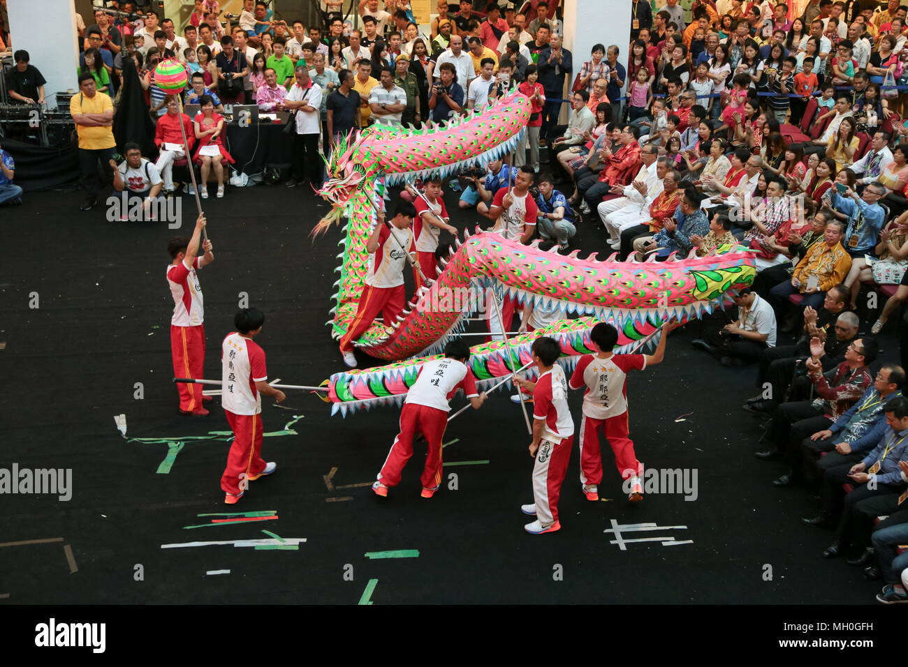 Group of teenagers orchestrating traditional dragon dance at VIVA HOME ...