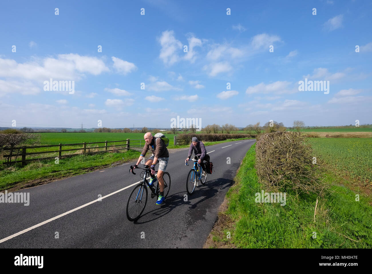 people cycling along a road Stock Photo - Alamy
