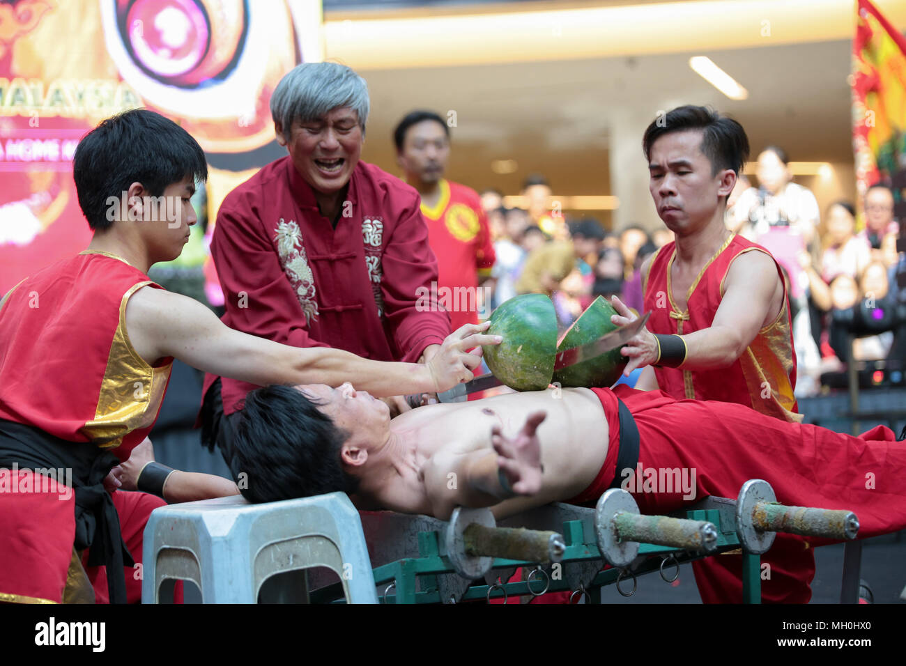 Chinese traditional stuntman master using sword to cut watermelon ...