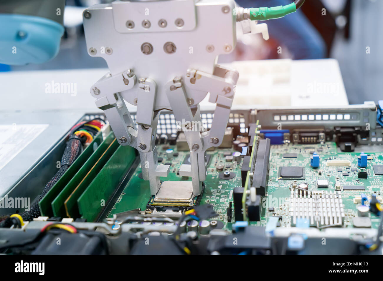 Robotic arm installing a computer chip Stock Photo - Alamy