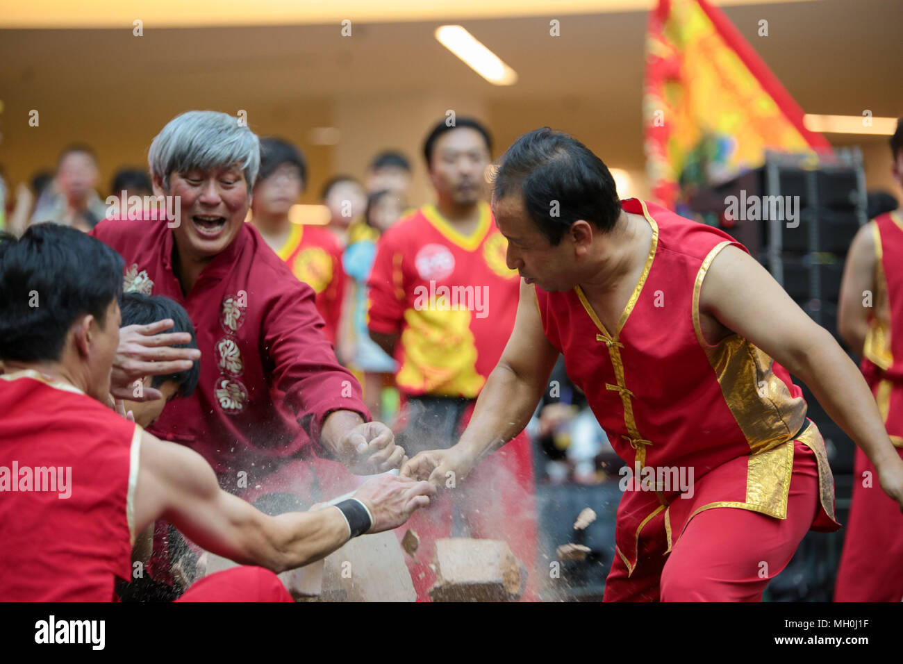 Chinese traditional stuntman smashing brick on hand at VIVA HOME ...
