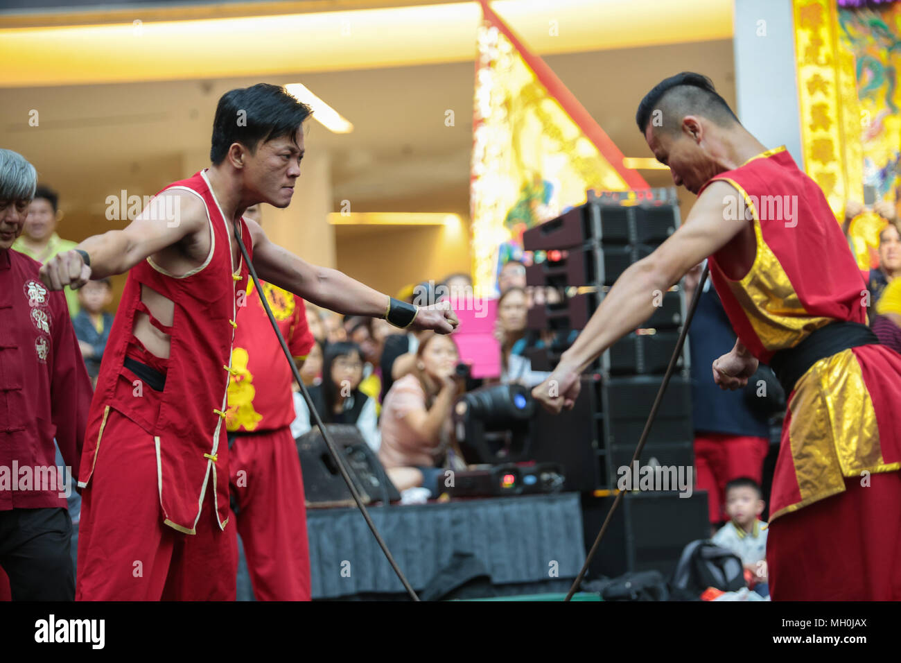 Chinese traditional stuntmans bending steel rod with their throats at ...