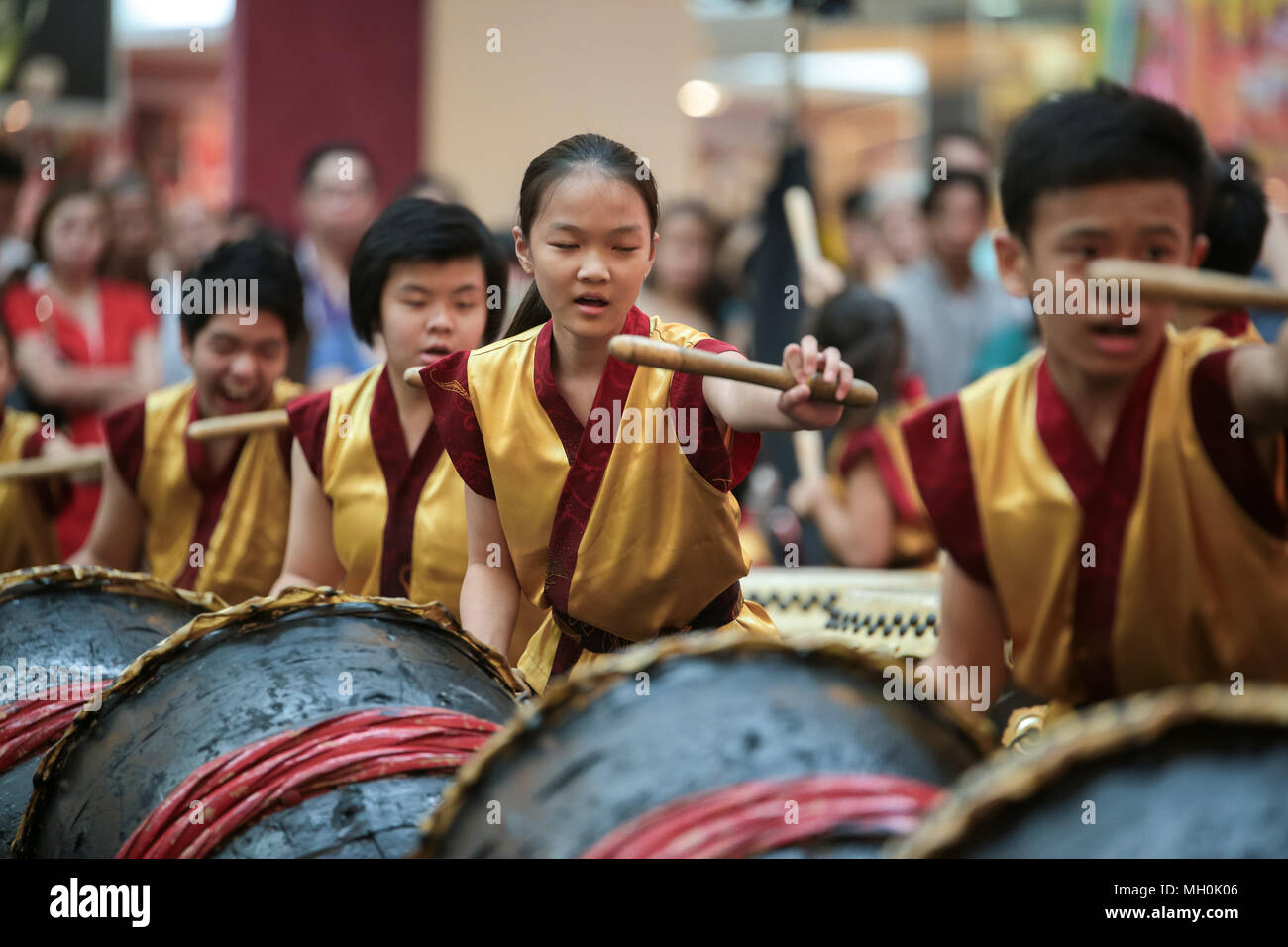 Teenagers performing chinese lion dance drum rhythmic show and dance at ...
