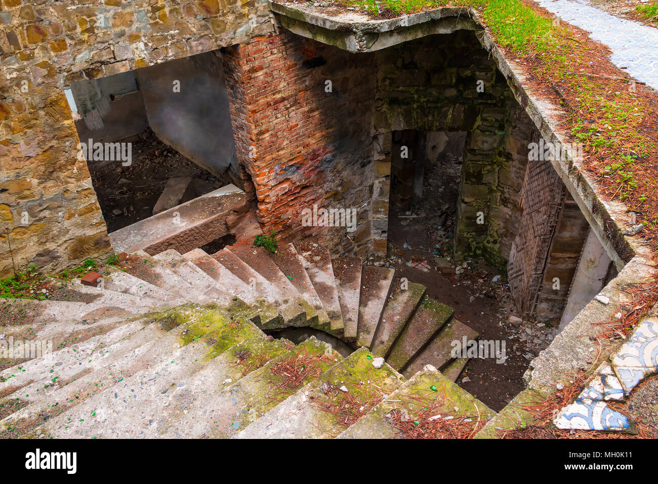 High-angle view of the staircase in the hall of the abandoned old ...