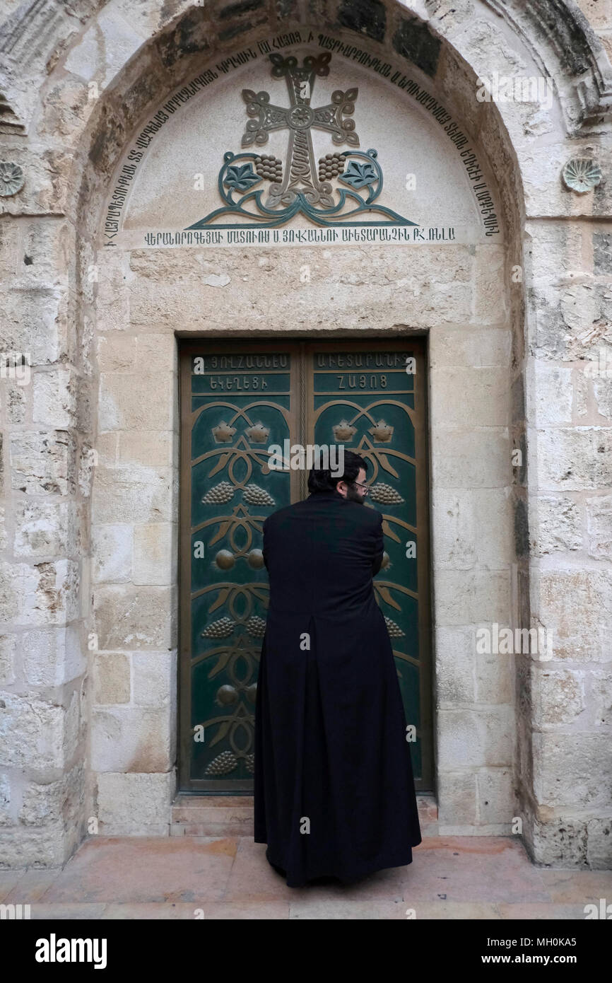 An Armenian priest closing the doors of the Armenian Chapel of Saint ...