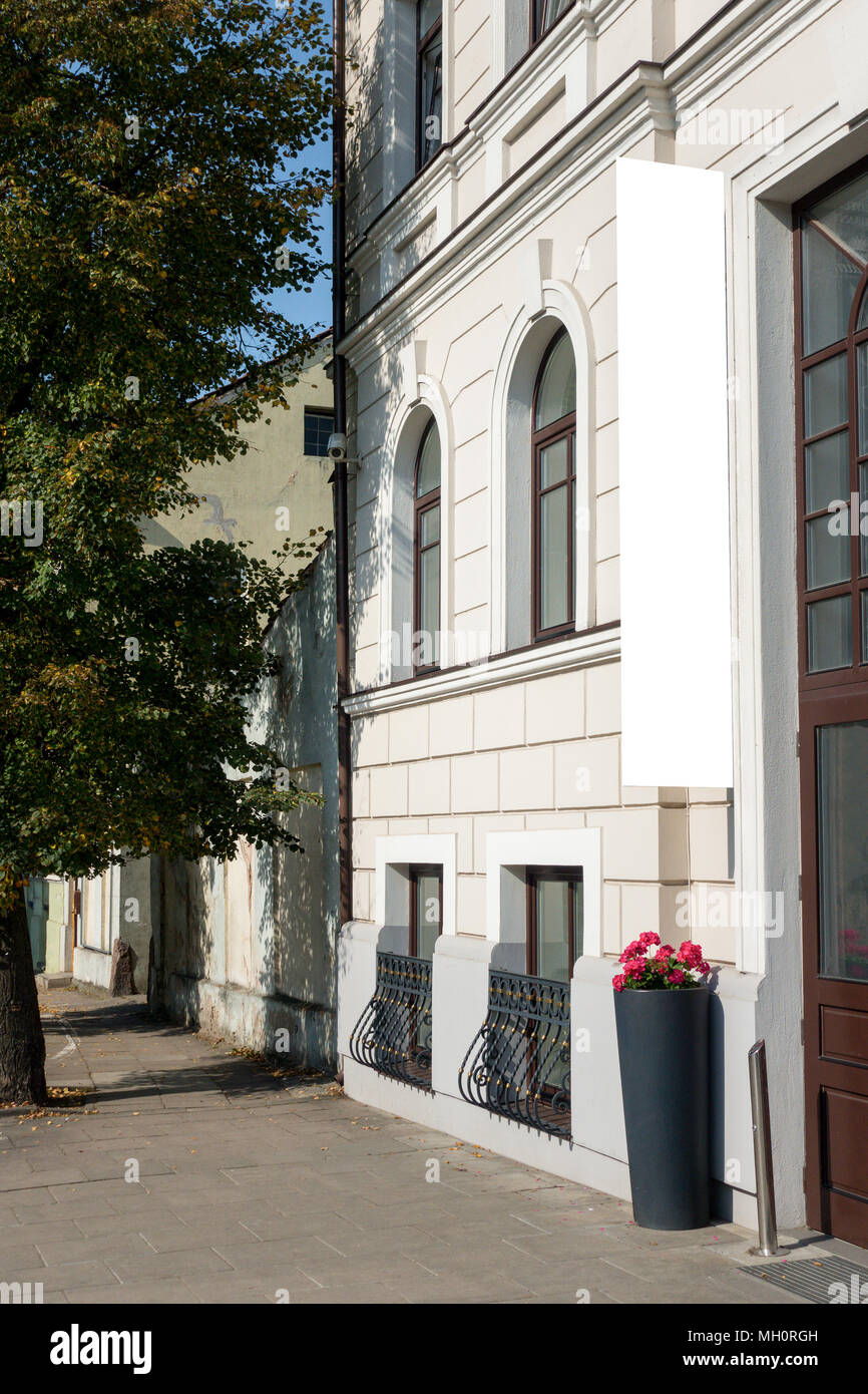 Horizontal front view of blank rectangular signage on a building with ...