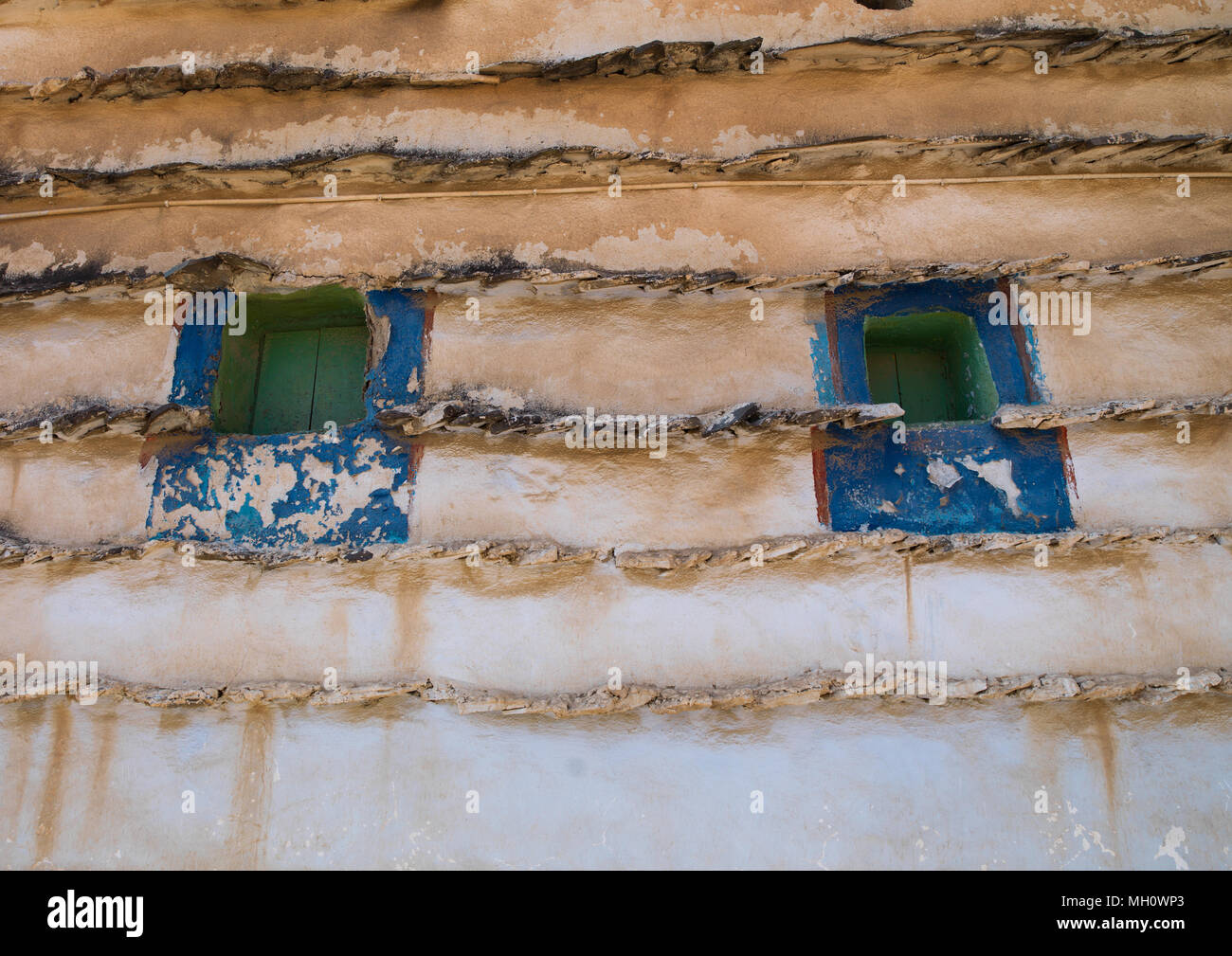Windows of a traditional clay and silt home in a village, Asir Province ...