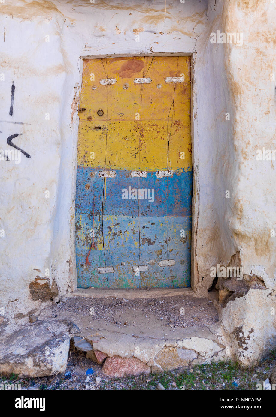 Door of a traditional clay and silt home in a village, Asir Province ...