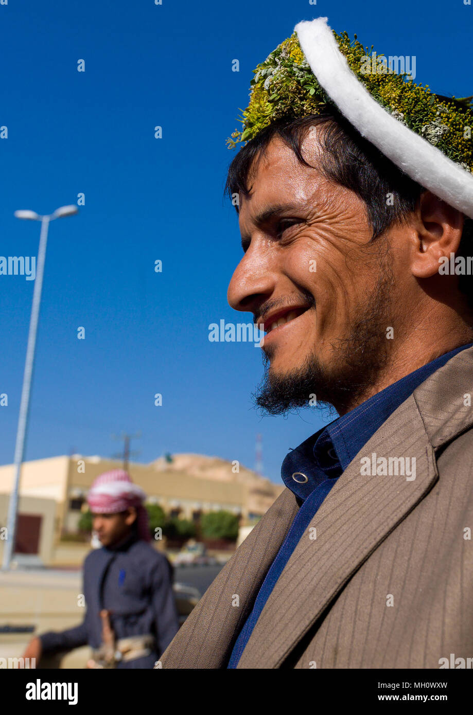 Portrait of a smiling saudi flower man, Asir province, Al Farsha, Saudi ...