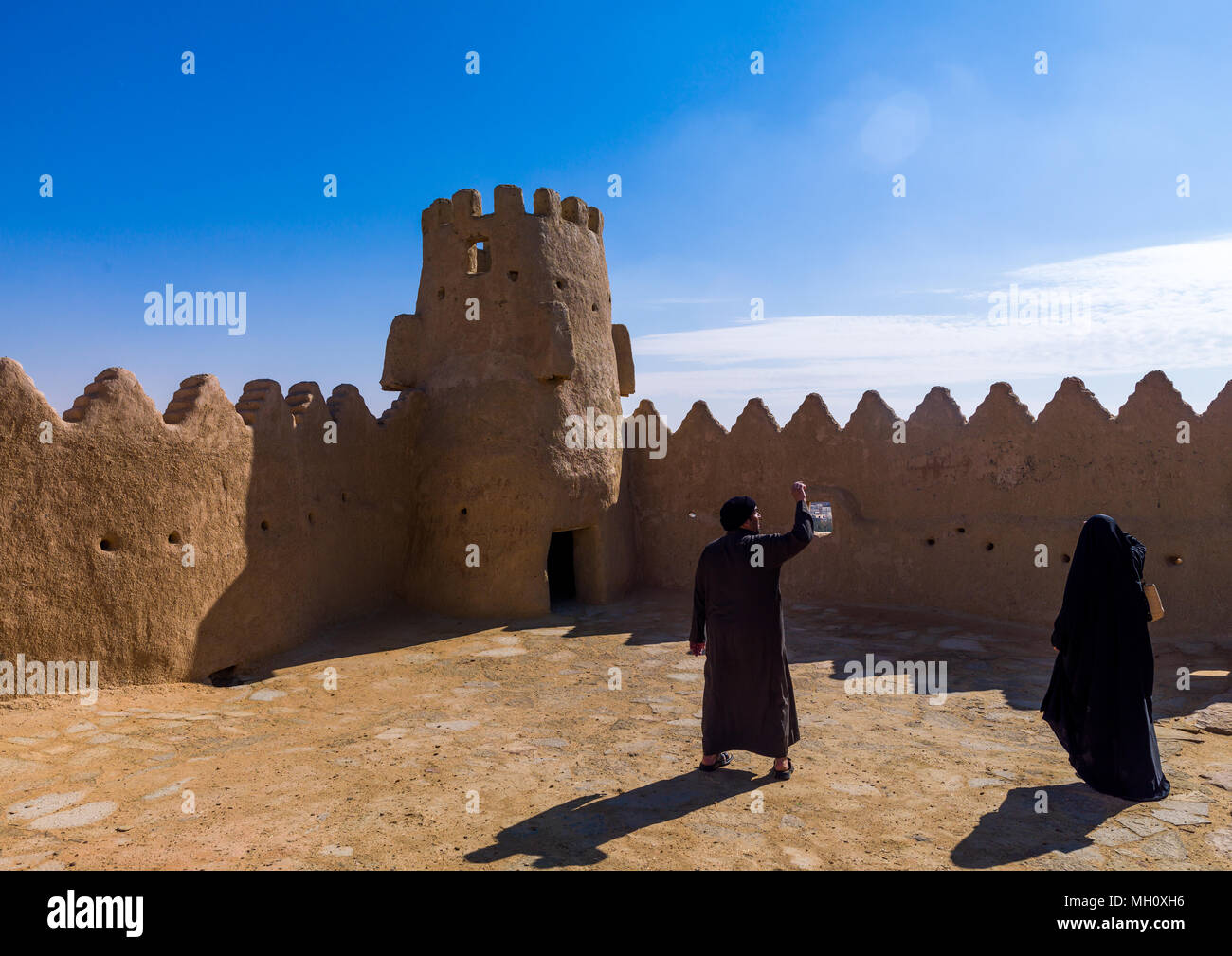 Saudi tourists taking pictures in the court of qasr zaba'al, Al-Jawf ...