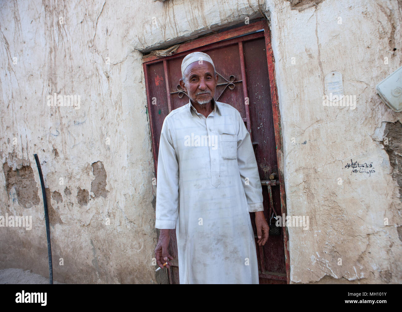 Saudi man smoking in the street, Najran Province, Najran, Saudi Arabia ...