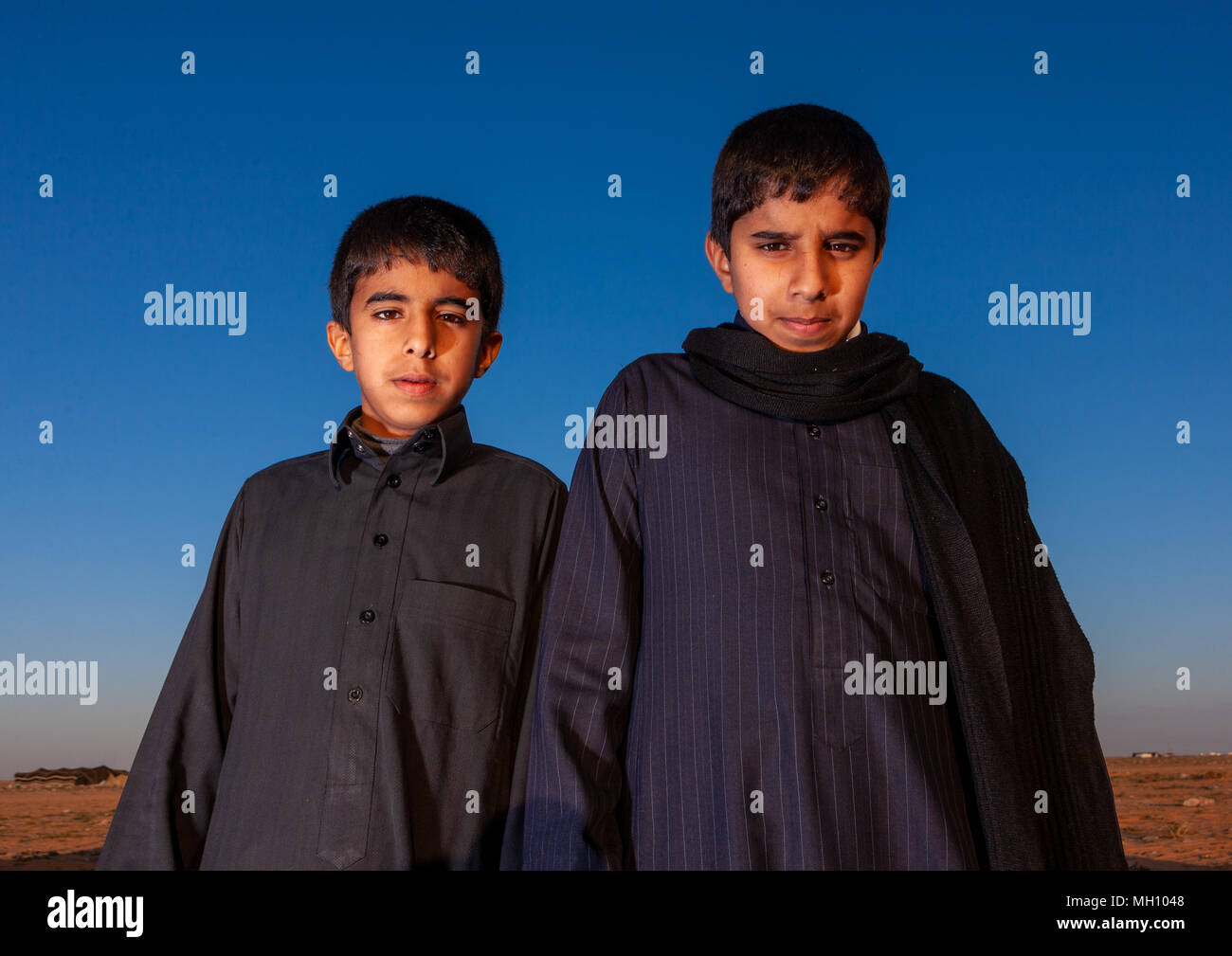 Portrait of two saudi boys, Al Madinah Province, Al-Ula, Saudi Arabia ...
