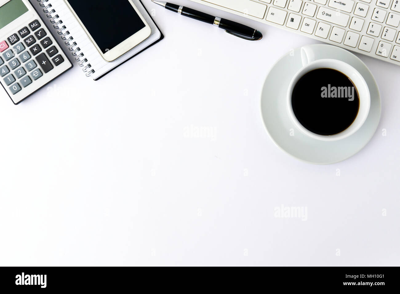 Top view of office desk table with calculator, pen, laptop computer and ...