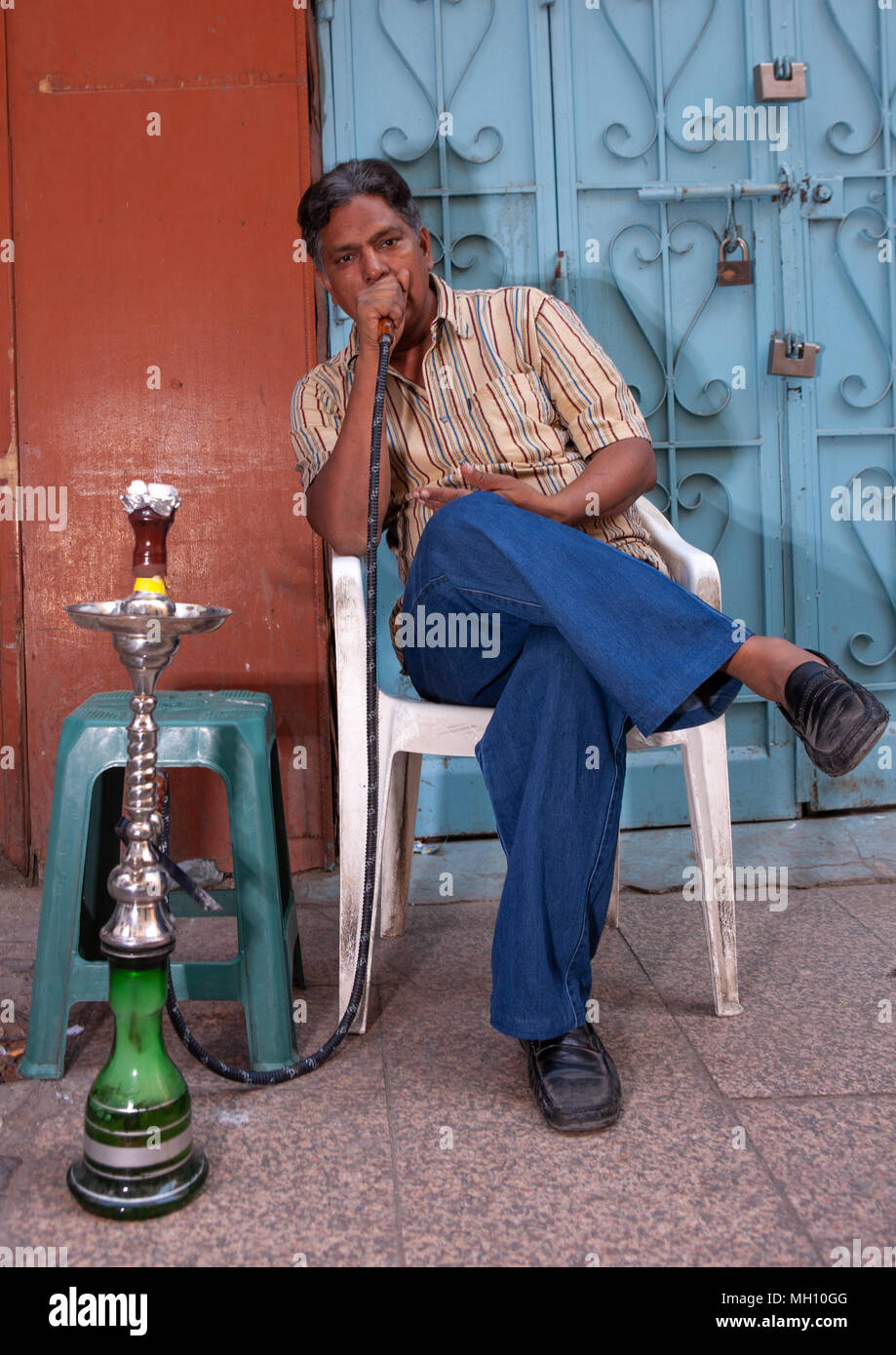 Man smoking water pipe in the street, Hijaz Tihamah region, Jeddah ...