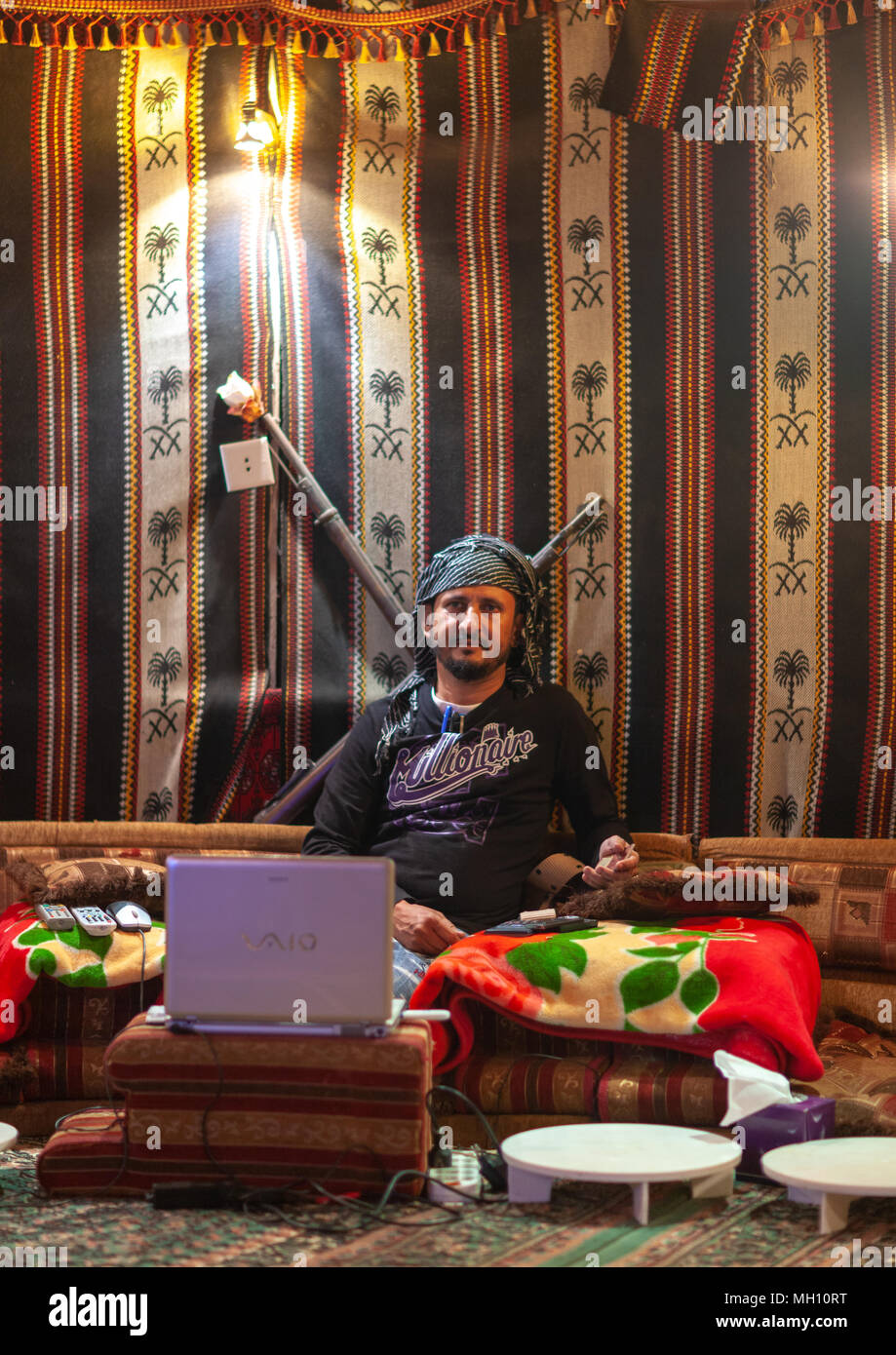 Saudi man using his computer inside his tent, Al-Sarawat, Fifa ...