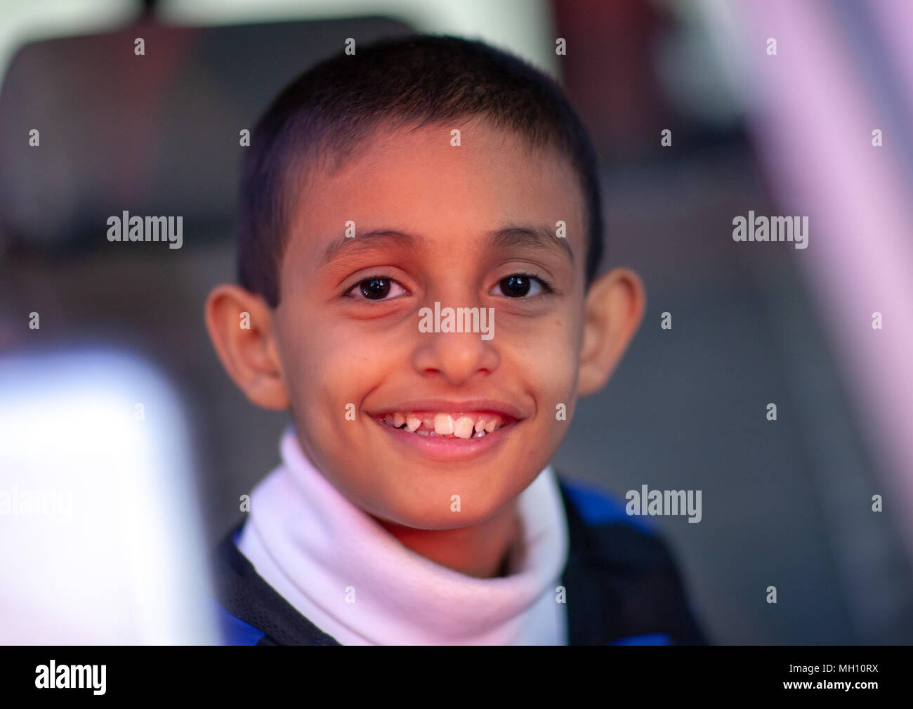 Portrait of a smiling saudi boy, Al-Sarawat, Fifa Mountains, Saudi ...
