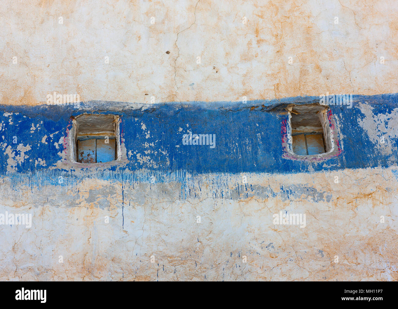 Old windows in a traditional clay houses in a village, Asir Province ...