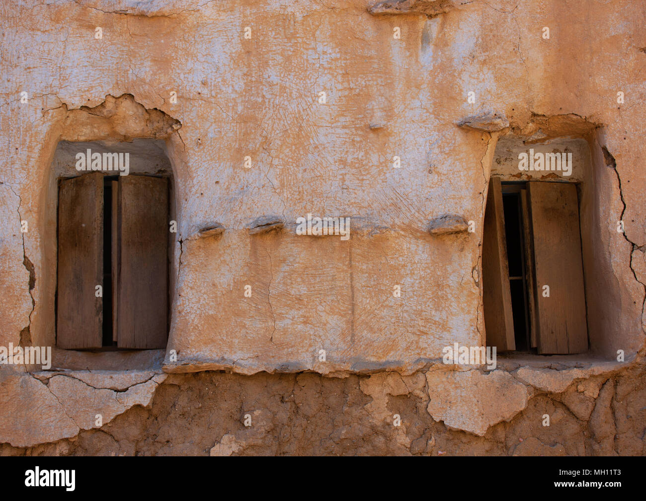 Old windows in a traditional clay houses in a village, Asir Province ...