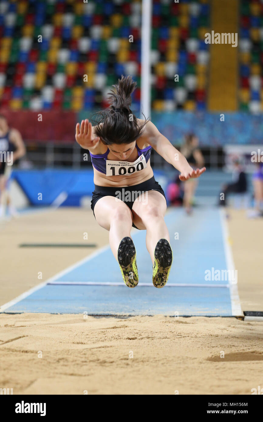 ISTANBUL, TURKEY - JANUARY 14, 2018: Undefined athlete long jumping ...
