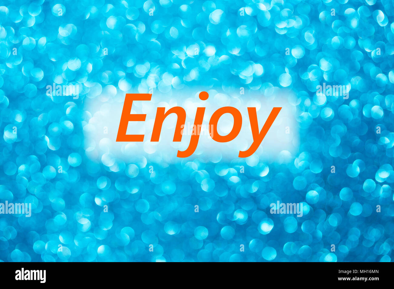 Detail of word "Enjoy" on a shiny blurred blue background Stock Photo ...